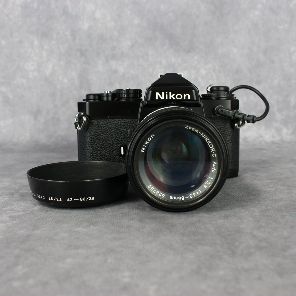 Nikon FE black + Nikkor 3.5/43-86mm | Single lens reflex camera (SLR) - online veiling Catawiki