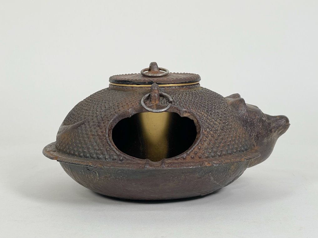 Iron Cast Depiction Of The Tale Of Tanuki 狸 Transforming Into An Iron Kettle Bunbuku