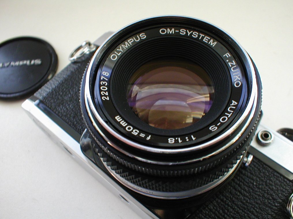 Olympus OM10 met Olympus Zuiko 50mm F/1.8 lens Single lens reflex camera (SLR) - Catawiki