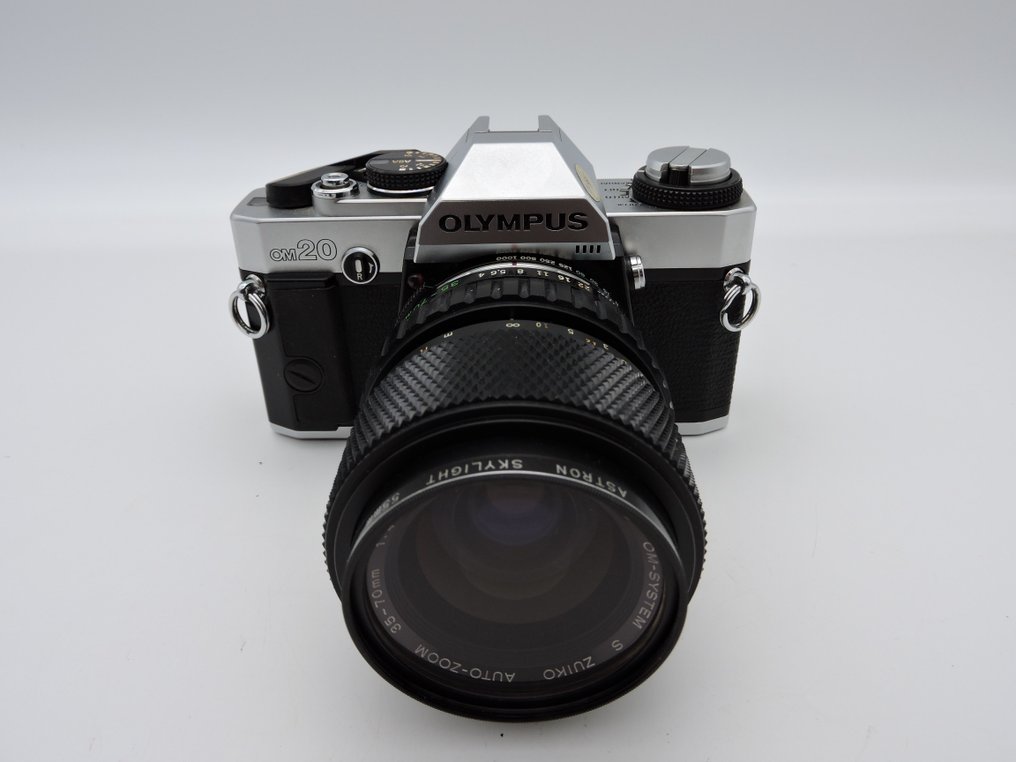 Olympus OM20 + Auto-Zoom 35-70mm 1:4 Appareil photo argentique - Catawiki