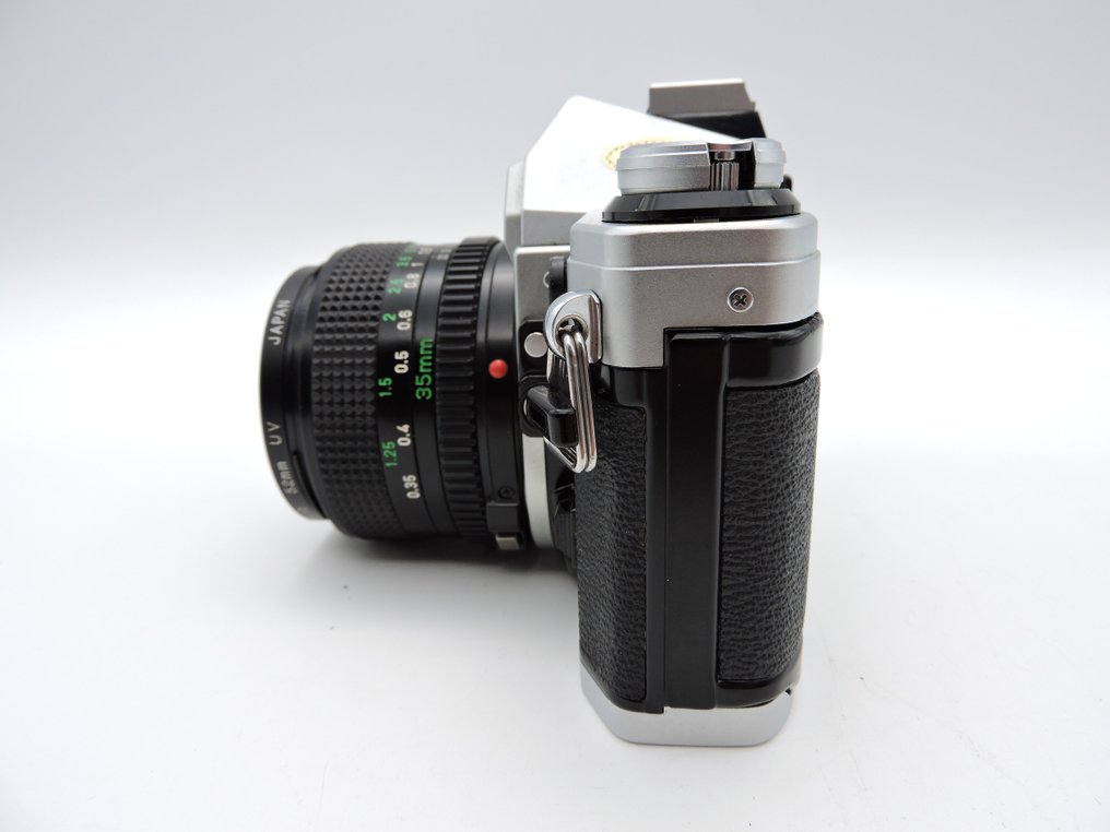 Canon AE-1 + FD 35mm 1:2.8 + UV + Zonnekap | Appareil photo reflex mono-objectif (SLR) - Catawiki